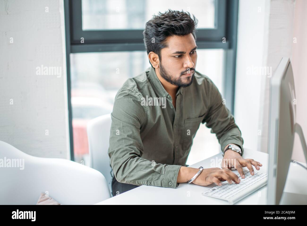 Pakistani man working office hi-res stock photography and images - Alamy
