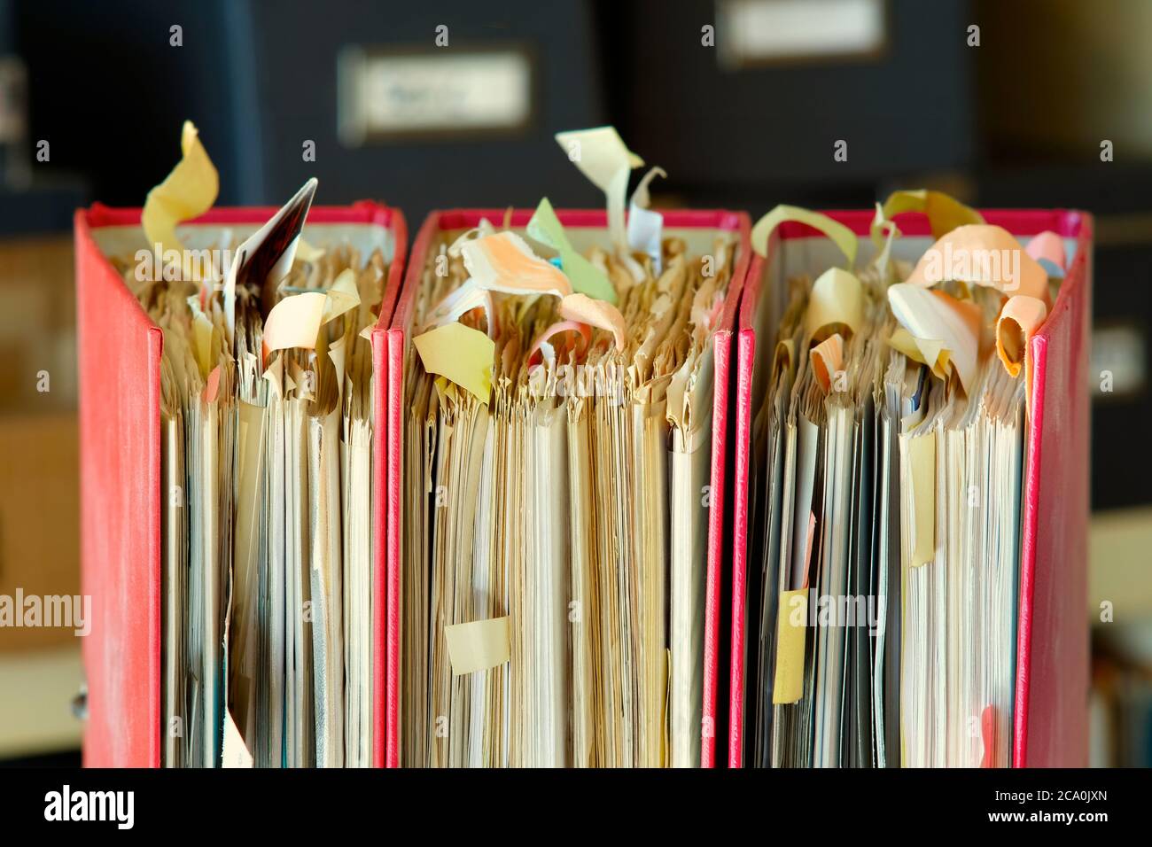 messy file folders and documents, bureaucracy and red tape concept ...