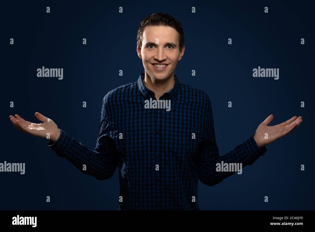 man with open arms presenting anything in ble studio isolated from ...