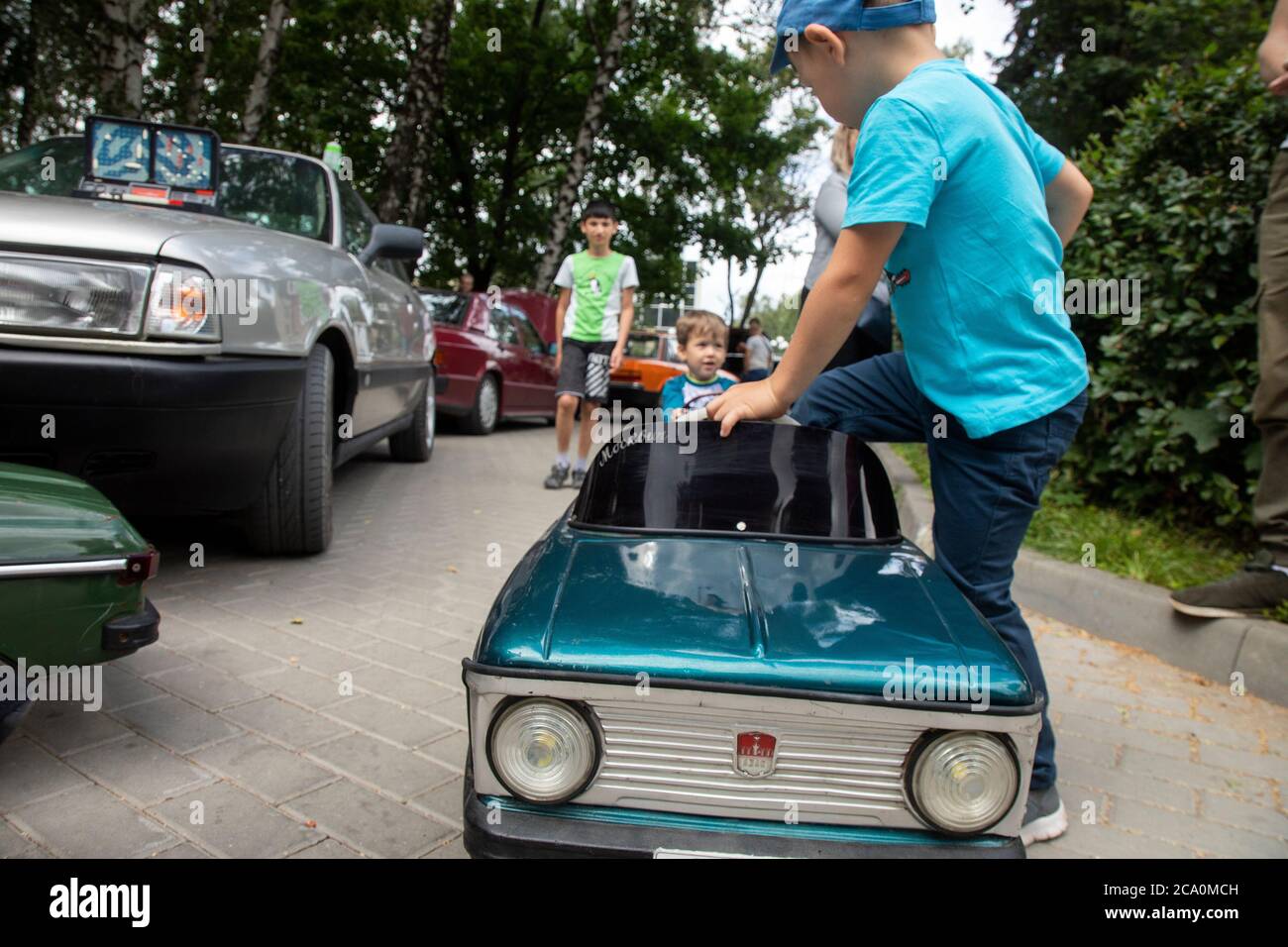 Ryazan, Russia. 1st of August, 2020 Little boys drive toy soviet retro ...