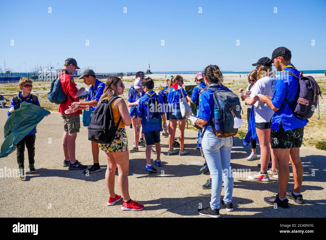 A group of scouts preparing themselves to clean the beach, he Beach, Le ...