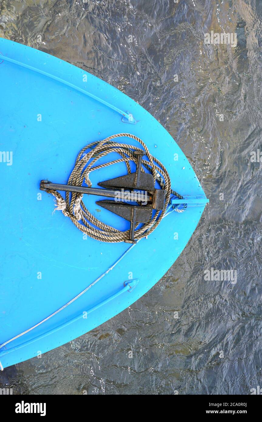 The bow of a boat floating on water with an anchor close-up Stock Photo ...