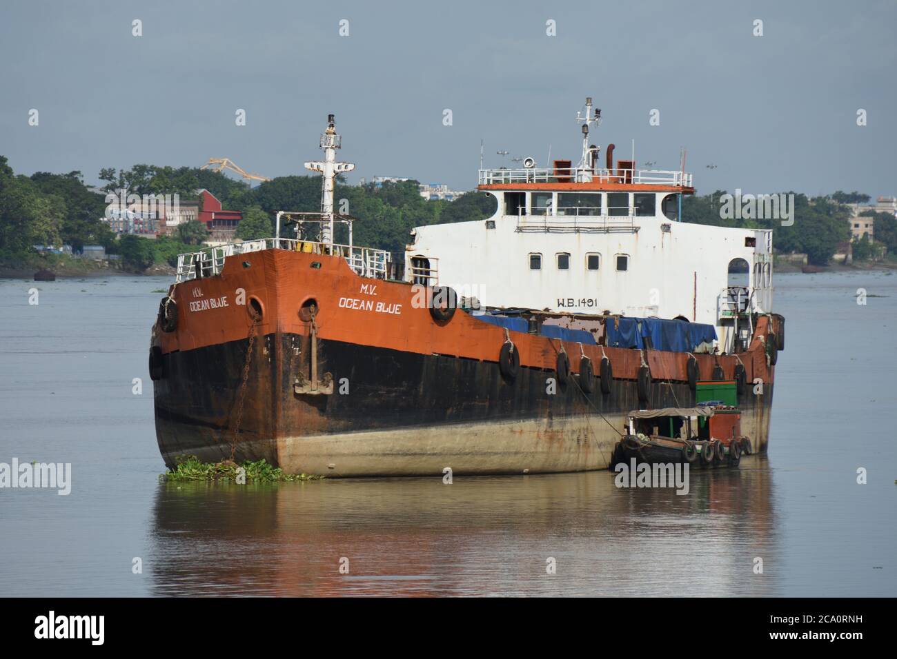 MV Ocean Blue (WB 1491) of India. Cargo ships on the Ganges or river ...