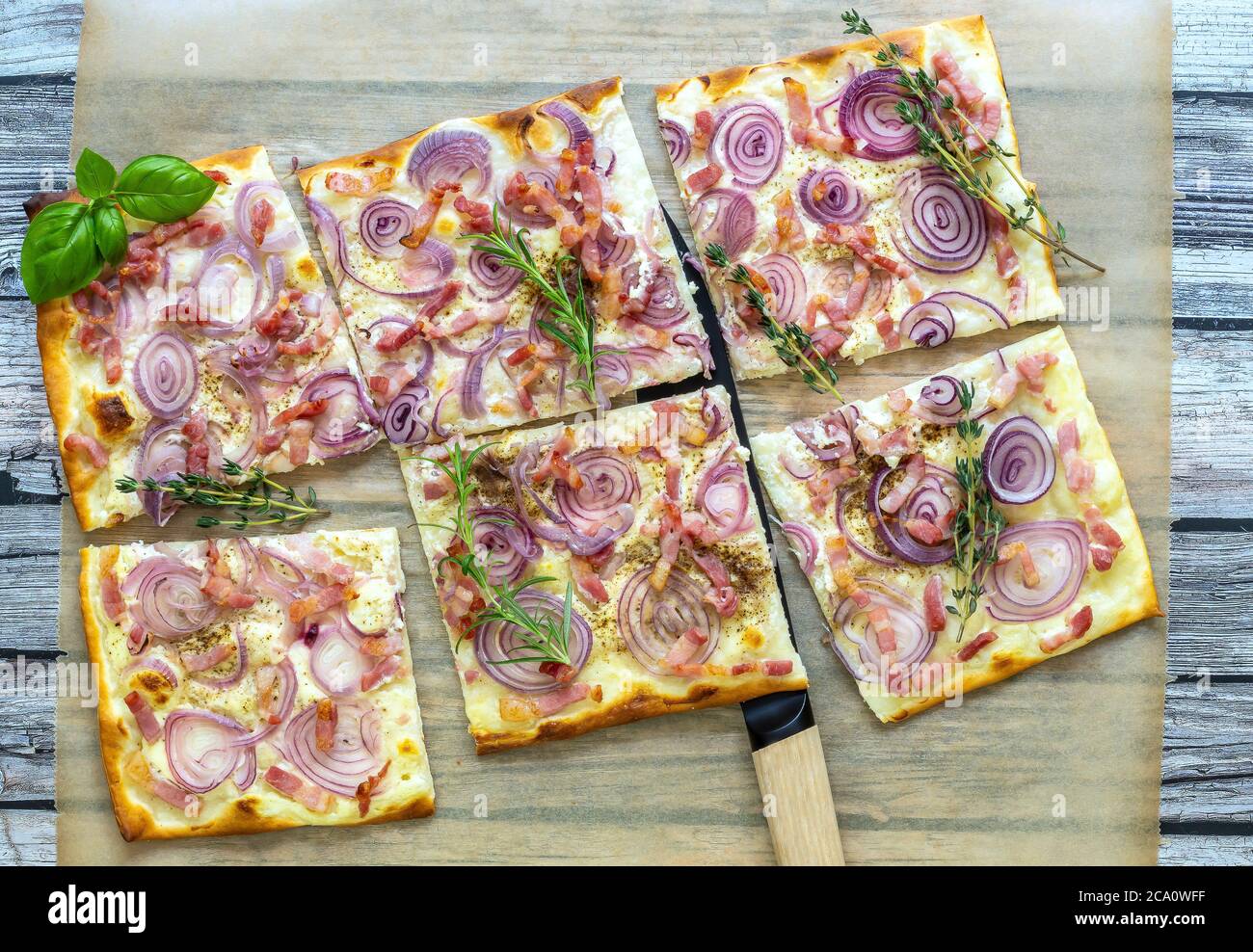 Traditional sliced german pizza or flammkuchen Stock Photo - Alamy