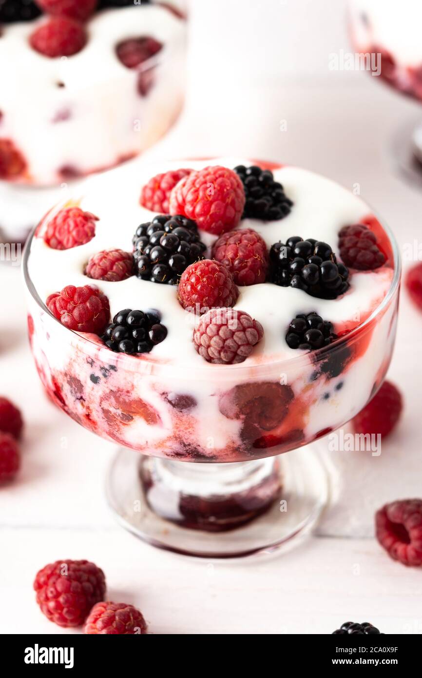 Delicious juicy berries of raspberries and blackberries with yoghurt in ...