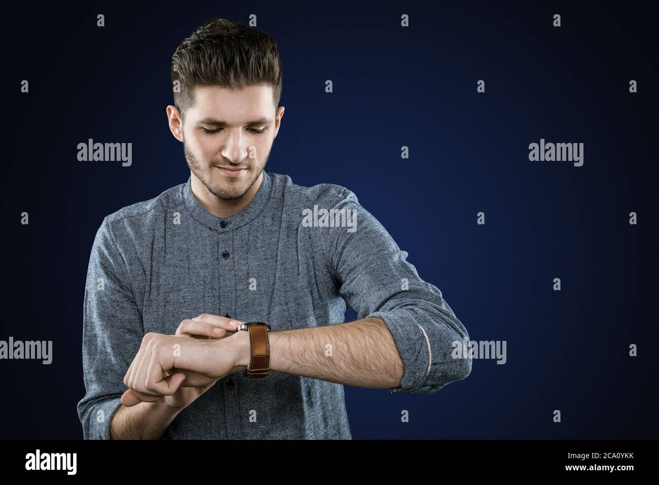 man with wristwatch look to watch on arm - What time is it Stock Photo ...