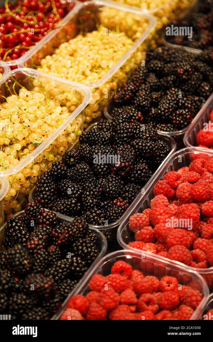 Colourful mix of different fresh berries at market Stock Photo - Alamy