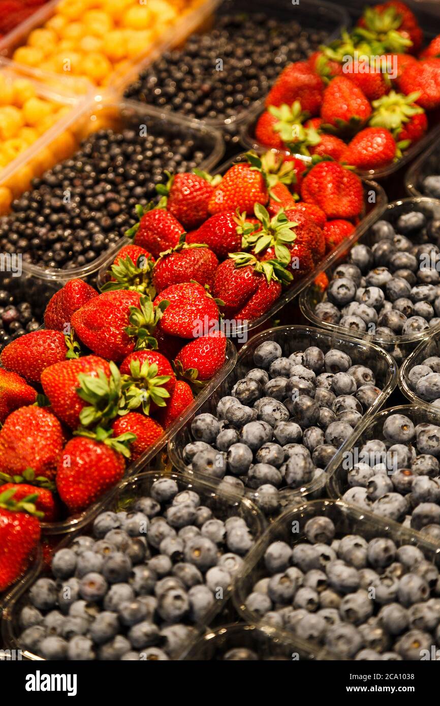 Colourful mix of different fresh berries at market Stock Photo - Alamy