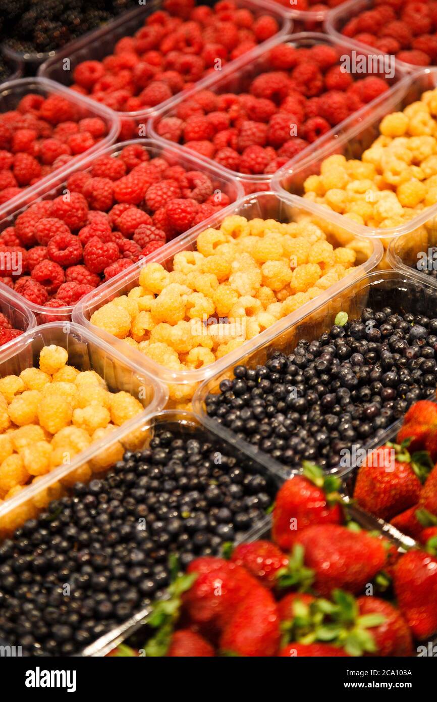 Colourful mix of different fresh berries at market Stock Photo - Alamy