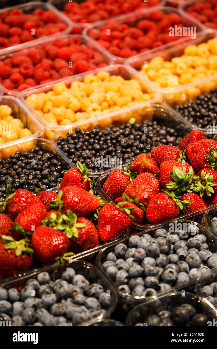 Colourful mix of different fresh berries at market Stock Photo - Alamy
