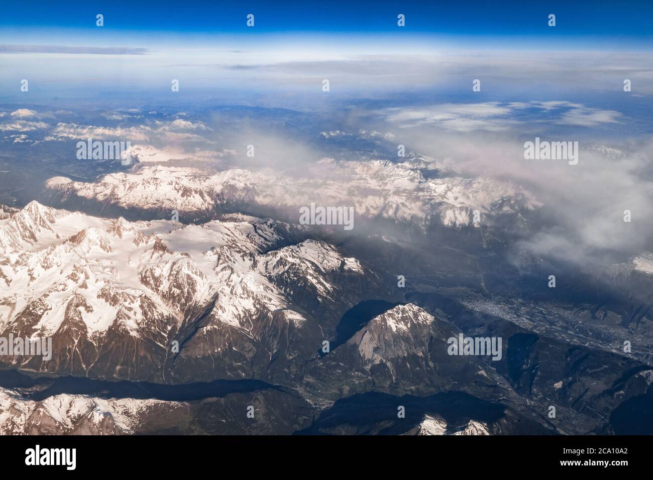 alps mountain view from above out of window of a plane Stock Photo - Alamy