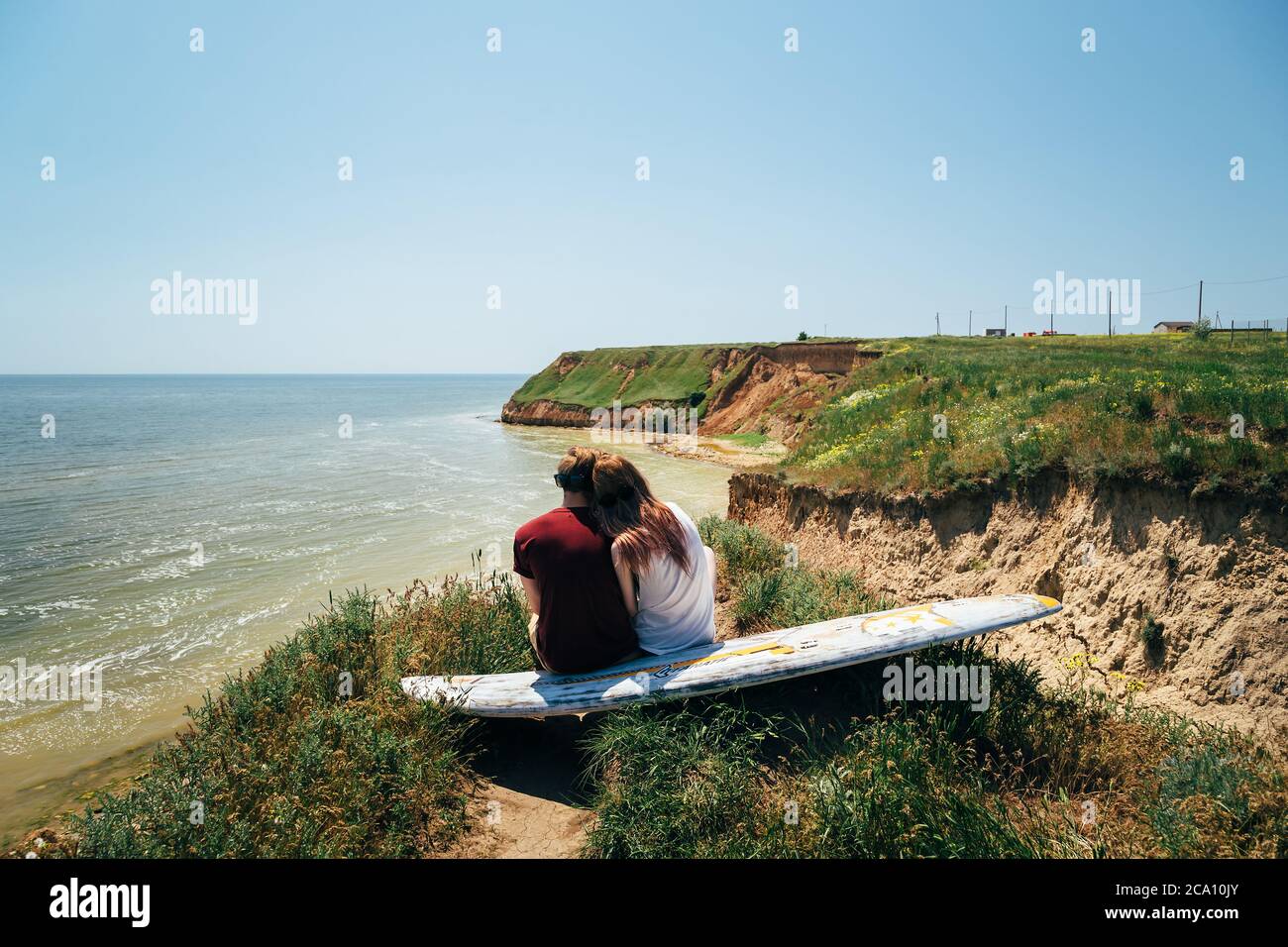 Surfboard woman hug beach hi-res stock photography and images - Alamy