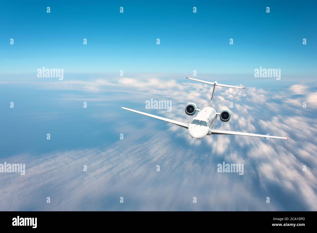Jet plane flying on blur motion sky background Stock Photo - Alamy