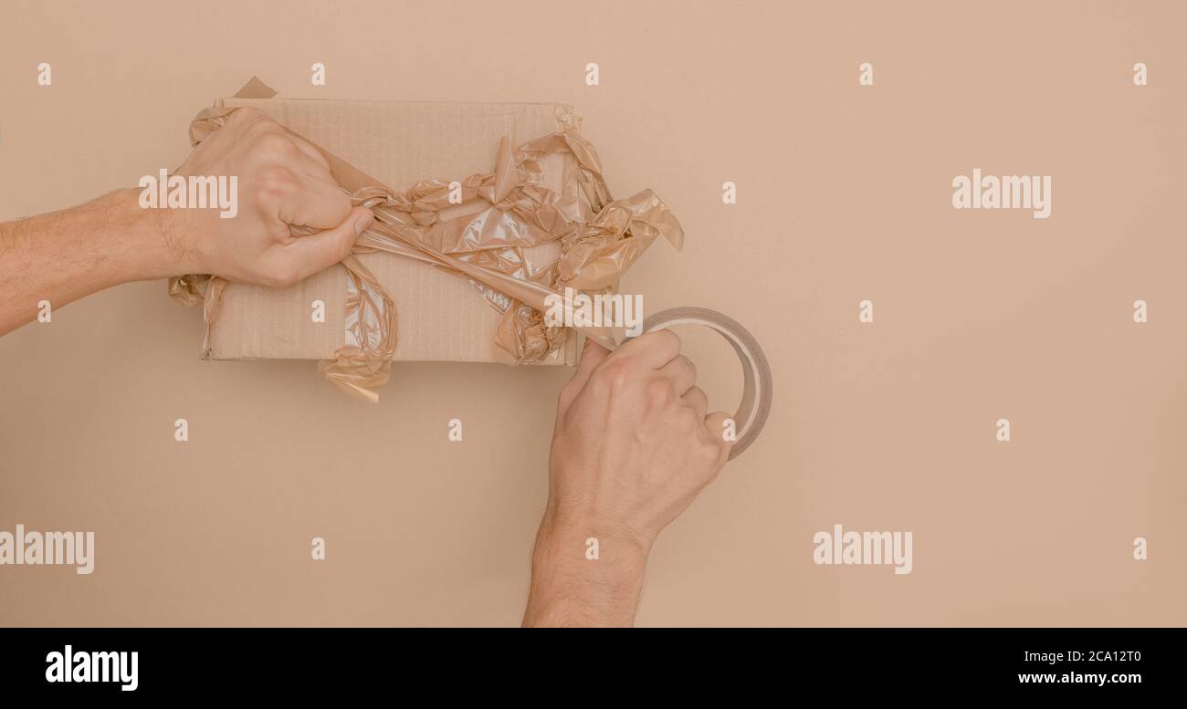 streched and crumbled packaging tape on cardboard box failed to wrap ...