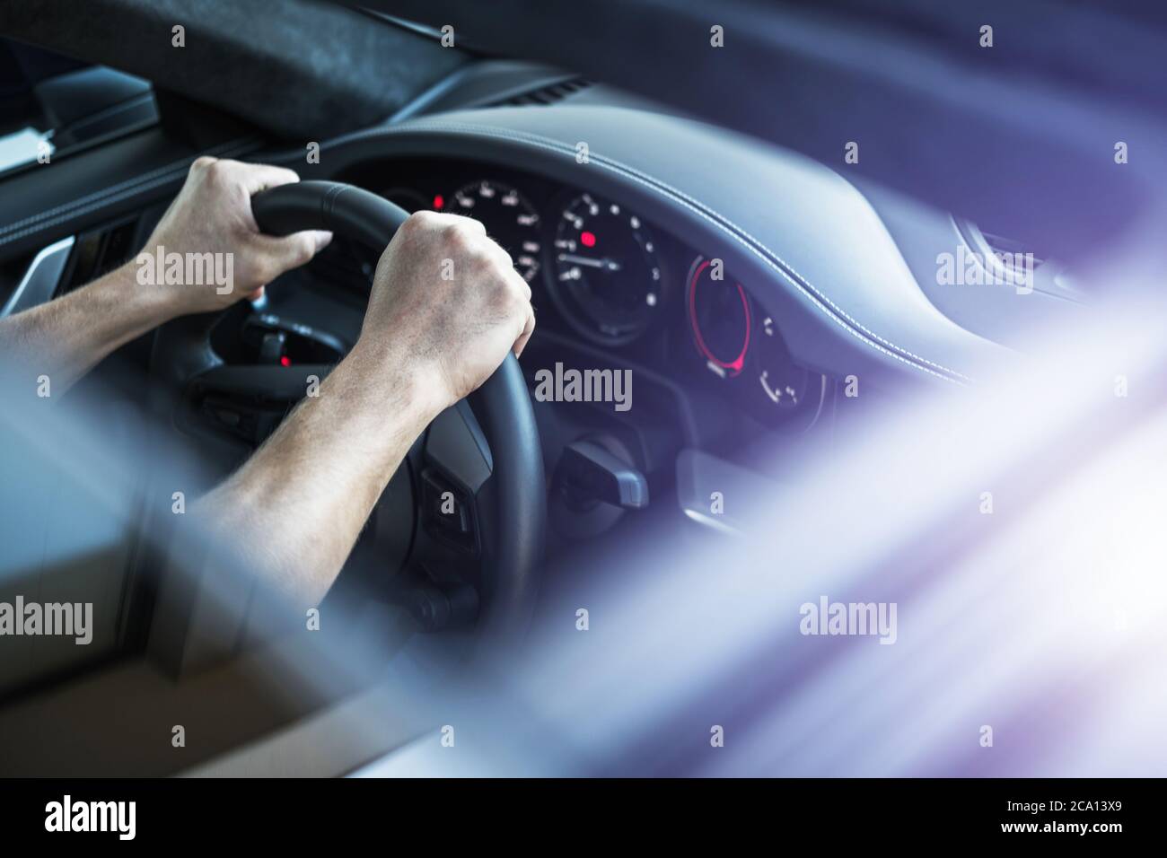 Caucasian Male Driver Behind Supercar Steering Wheel Taking Road Trip ...
