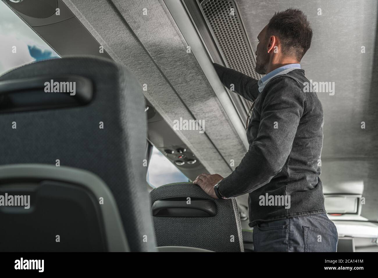 Modern International Coach Bus Passenger Securing His Luggage Inside ...