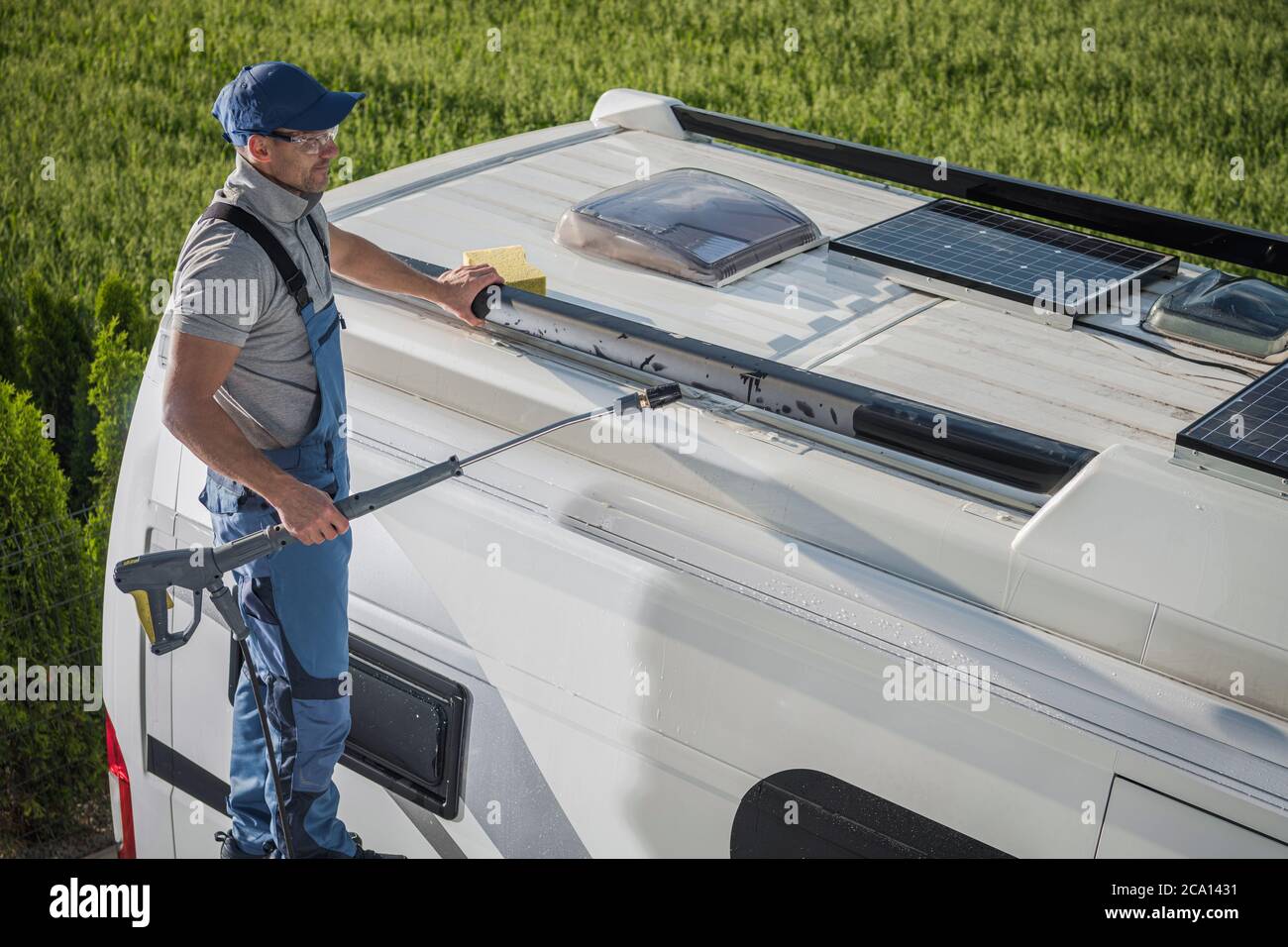 Smiling Caucasian Men in His 40s Washing His RV Recreational Vehicle ...