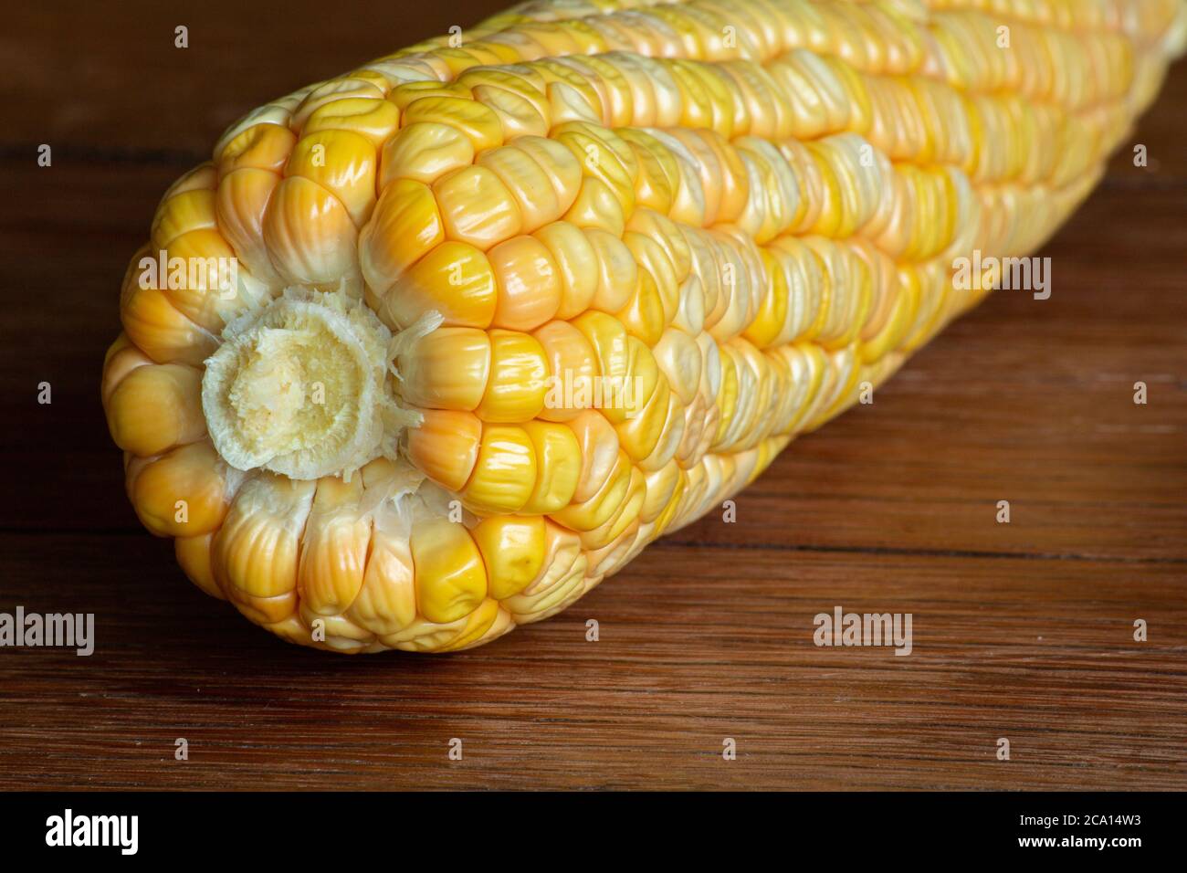 Corn cob on dark wooden rustic background. Detail texture. Macro Stock ...