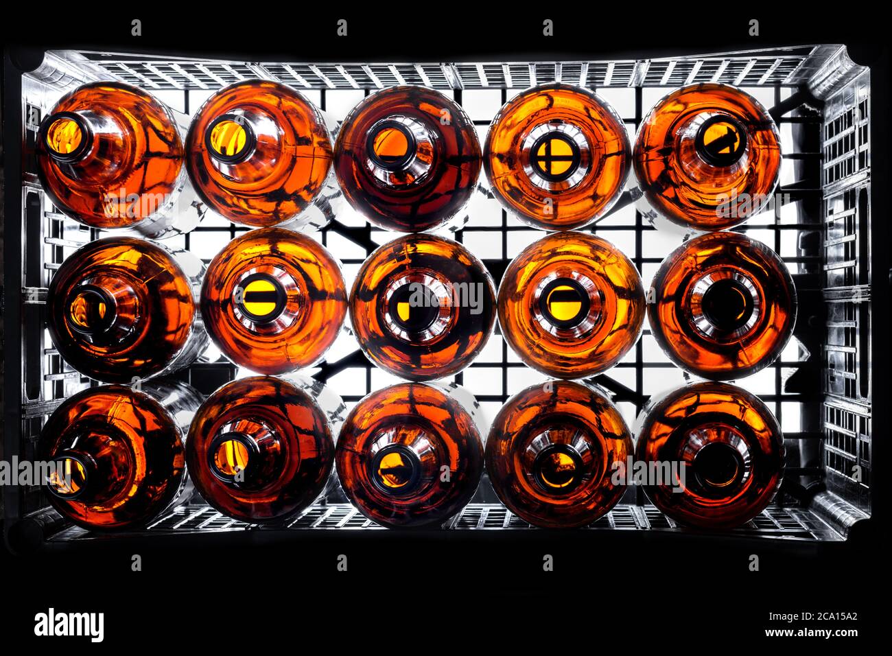 Empty beer amber bottle box with backlit aerial view Stock Photo - Alamy