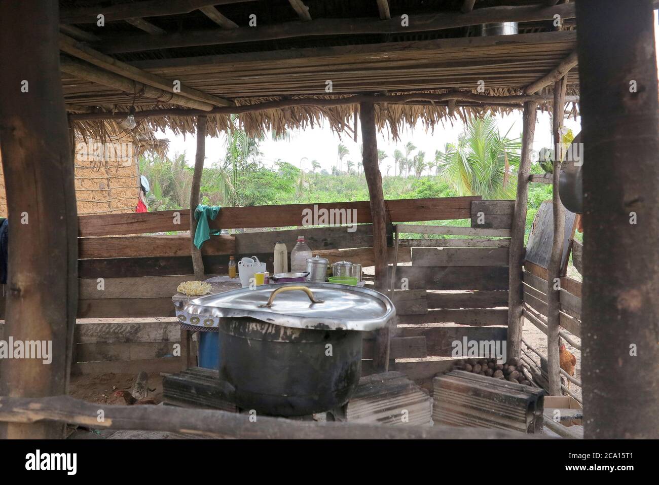 cauldron on firewood on poor house in shacks on favella inside Brazil ...
