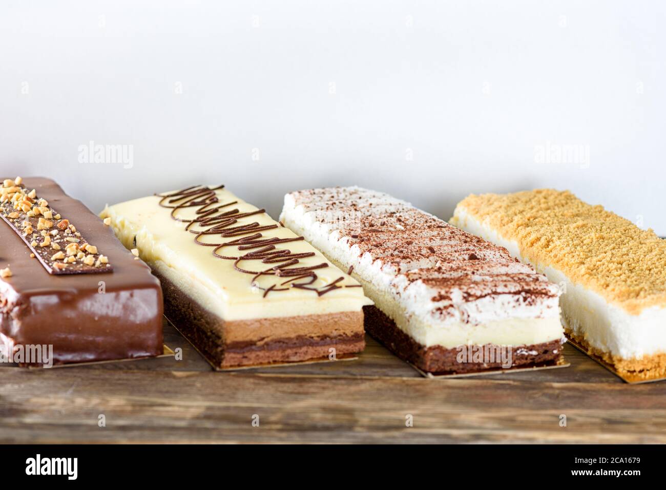 Beautiful Delicious dessert cheesecakes and chocolate cake. Group of ...