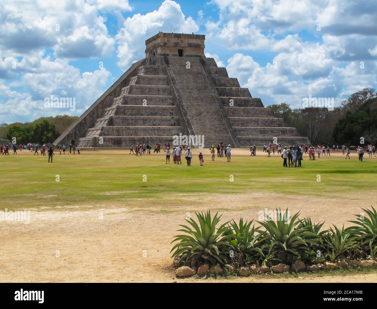 Tourist visiting Temple of Kukulcan in the archaeological site of ...