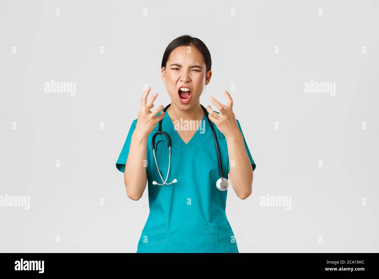 Covid-19, healthcare workers and preventing virus concept. Angry pissed ...