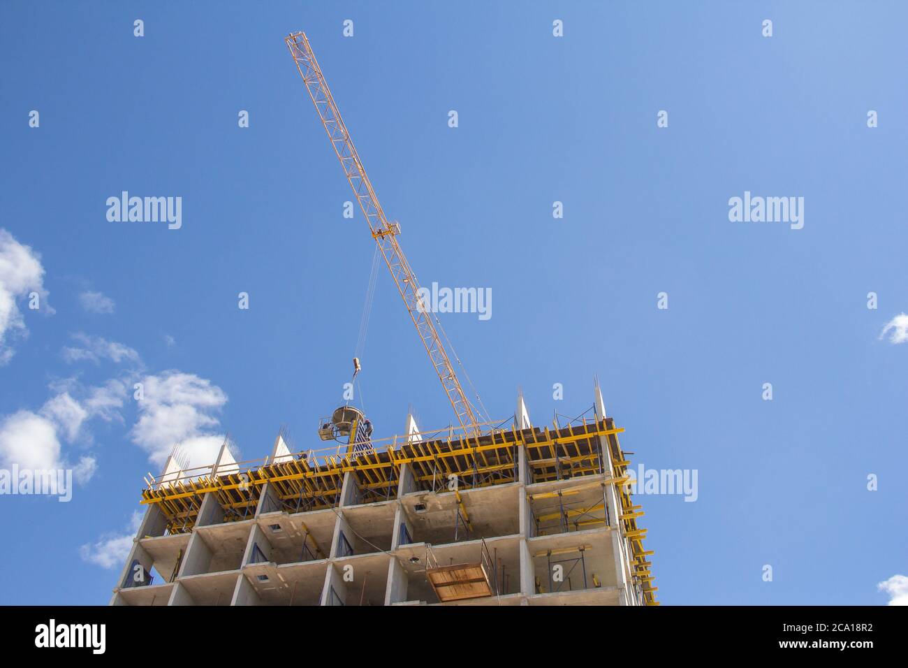 Pouring concrete on the construction of a high-rise building ...