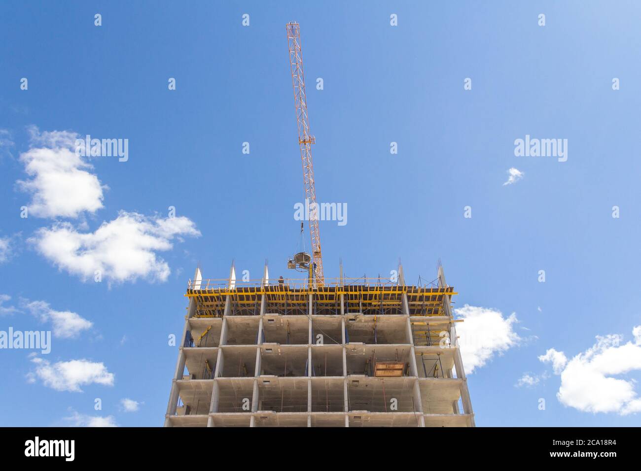 Pouring concrete on the construction of a high-rise building ...