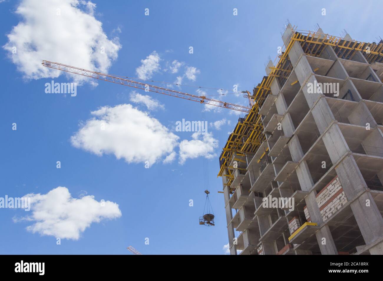 Pouring concrete on the construction of a high-rise building ...