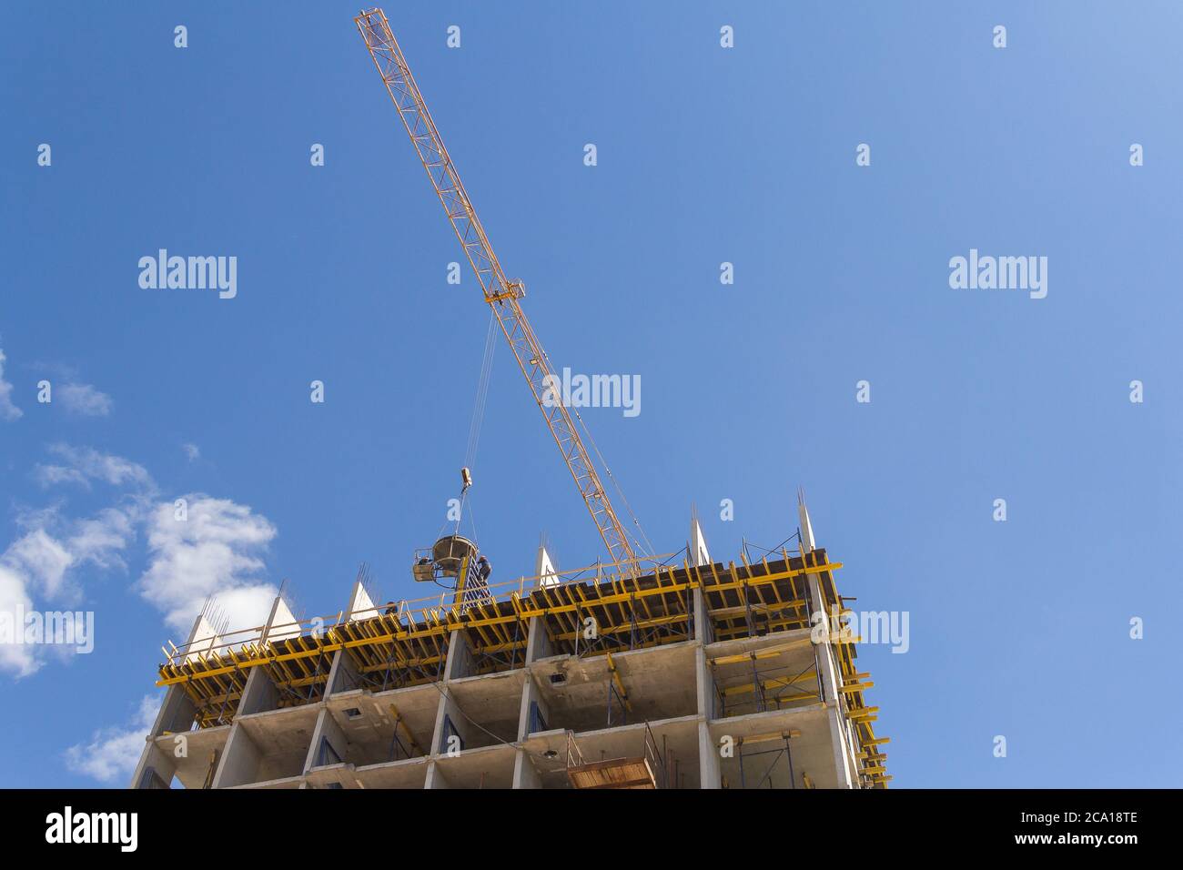 Pouring concrete on the construction of a high-rise building ...
