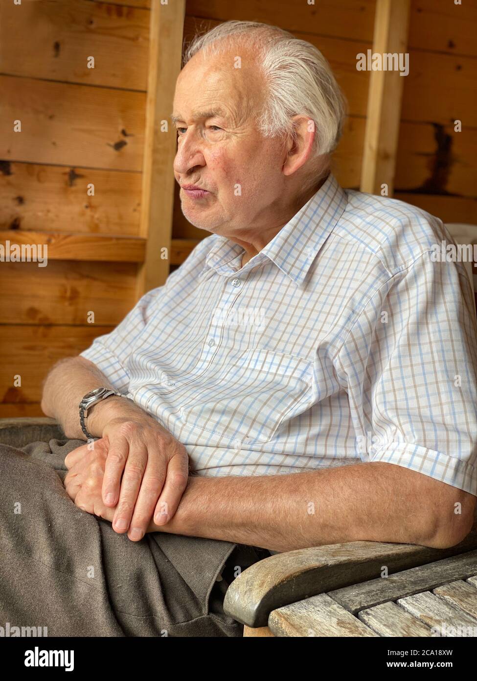 Senior man in garden shed relaxing in retirement Stock Photo - Alamy