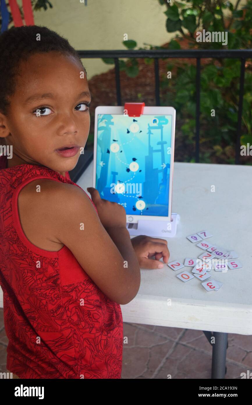 Young preschool black boy on Ipad Stock Photo - Alamy