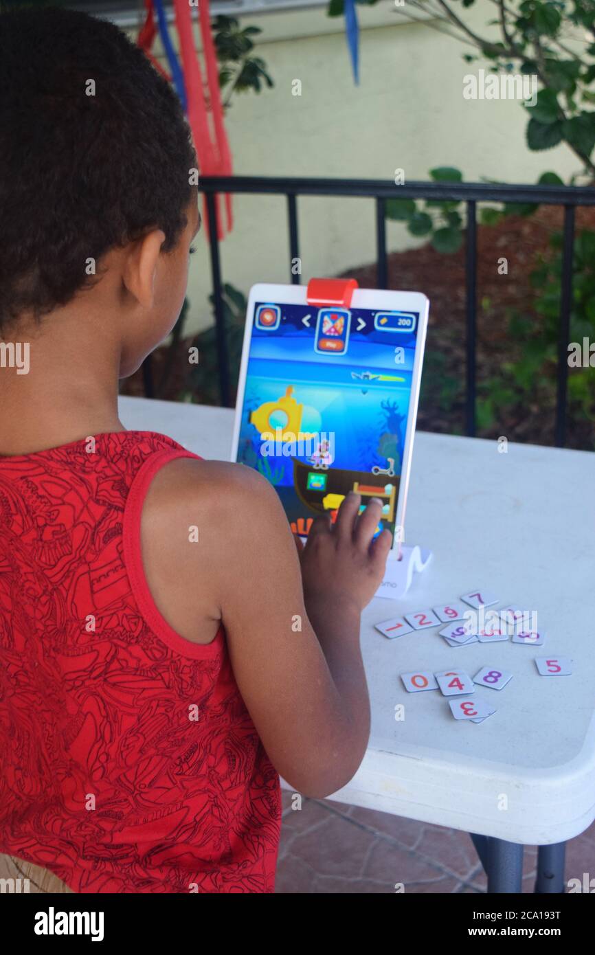 Young preschool black boy on Ipad Stock Photo - Alamy