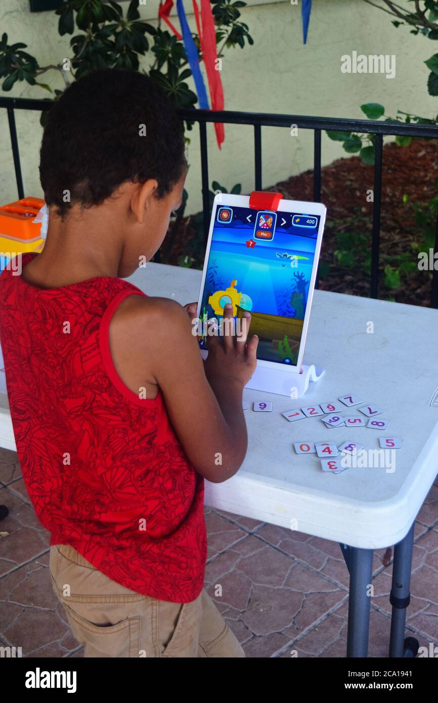 Child ipad african hi-res stock photography and images - Alamy