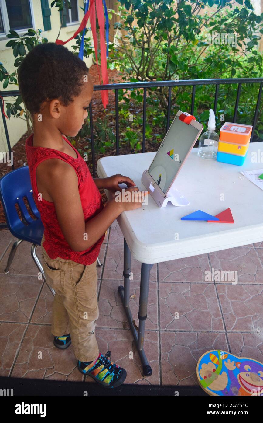 Child ipad african hi-res stock photography and images - Alamy