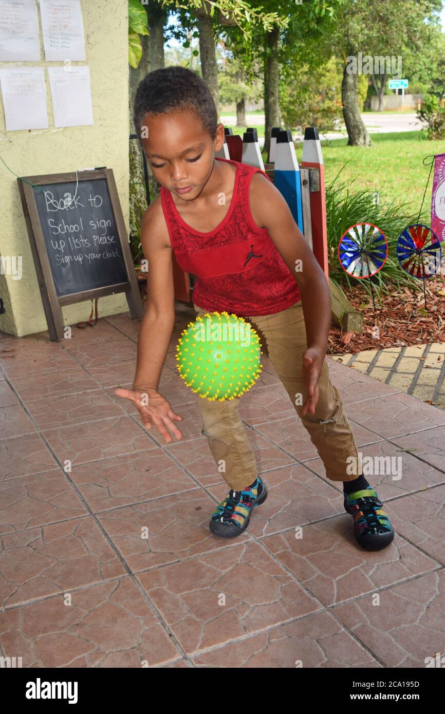 Child Catching A Ball