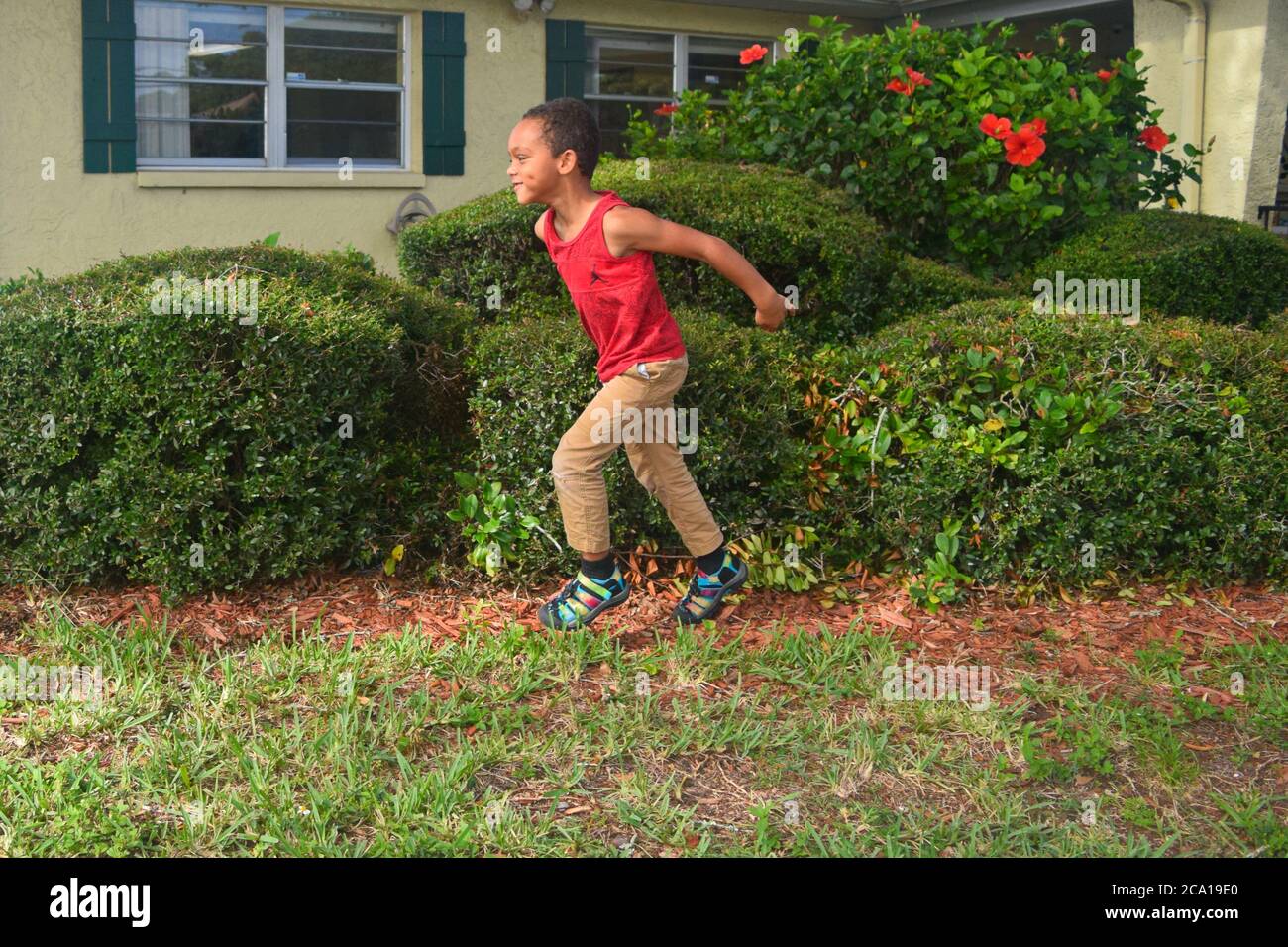 African american boy running hi-res stock photography and images - Alamy