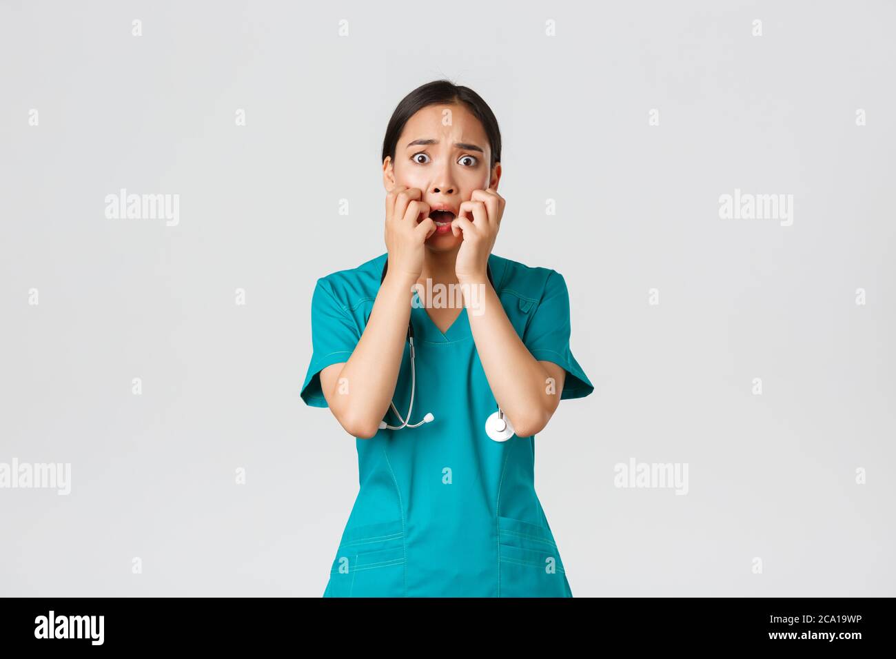 Covid-19, healthcare workers and preventing virus concept. Scared ...