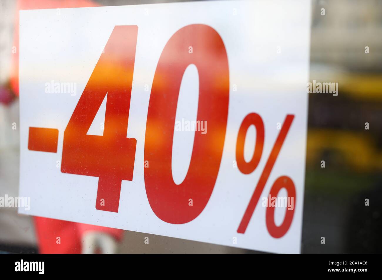 Discount advertisement hanging on glass door Stock Photo - Alamy