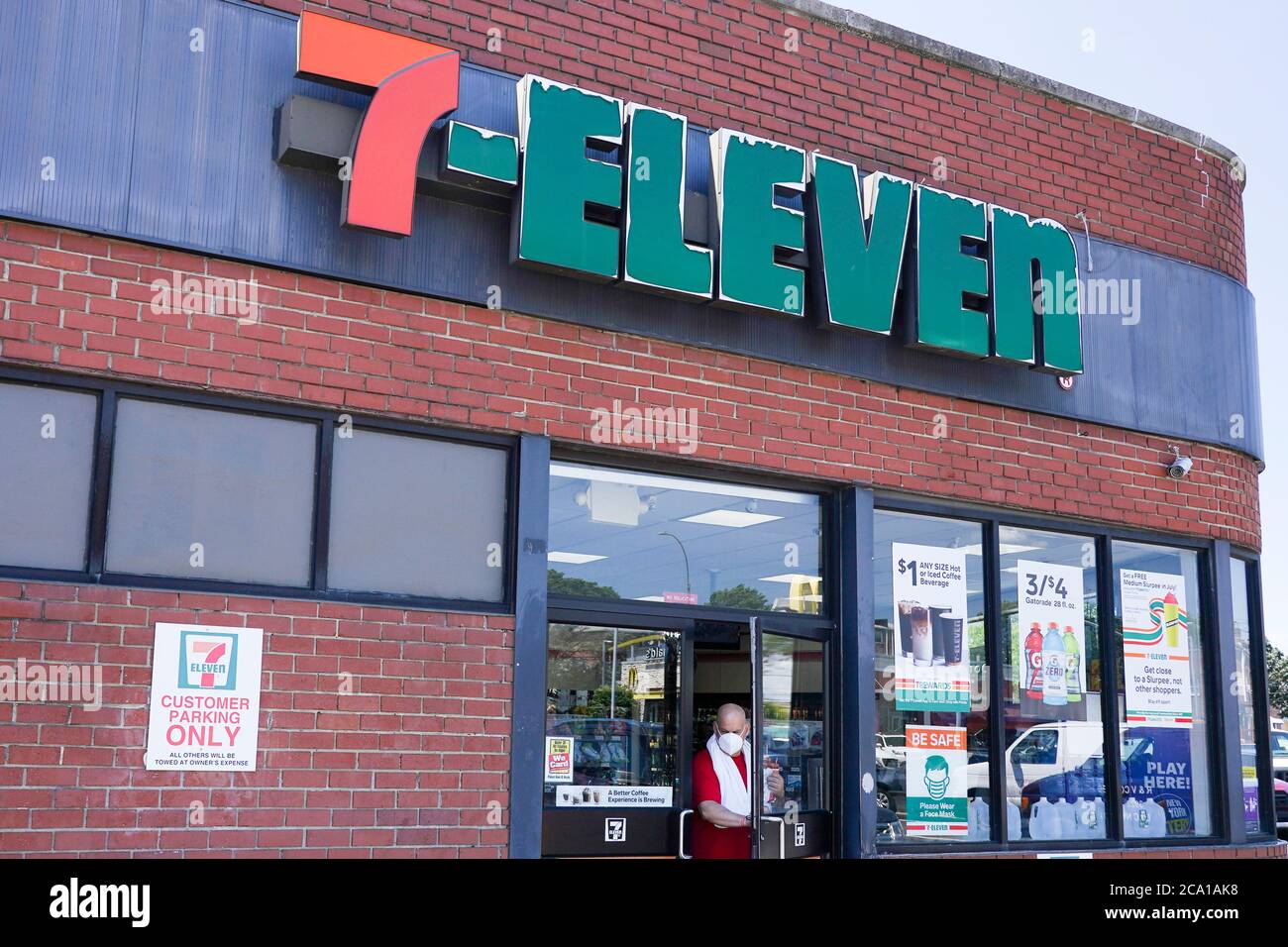 NEW YORK, NY – AUGUST 3: A man exits a 7-Eleven store in Queens on ...