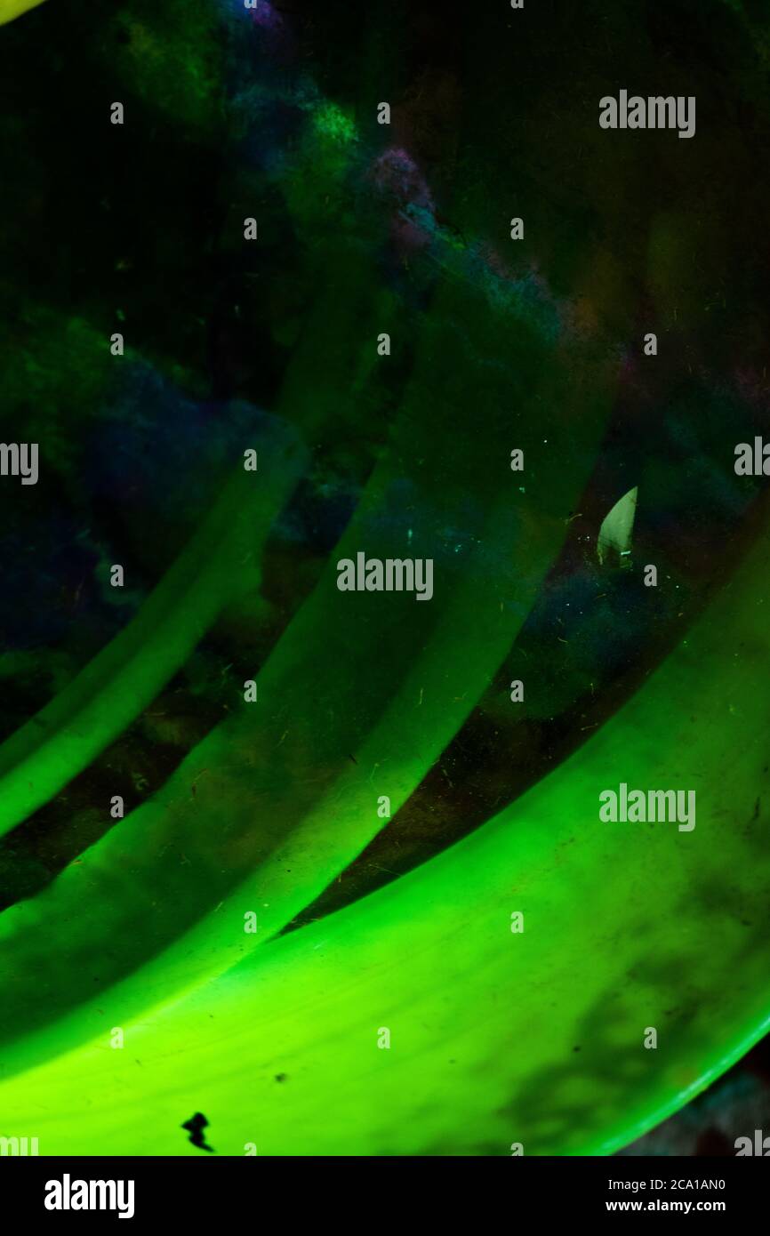 Abstract closeup of illuminated green lines fading into darkness Stock ...