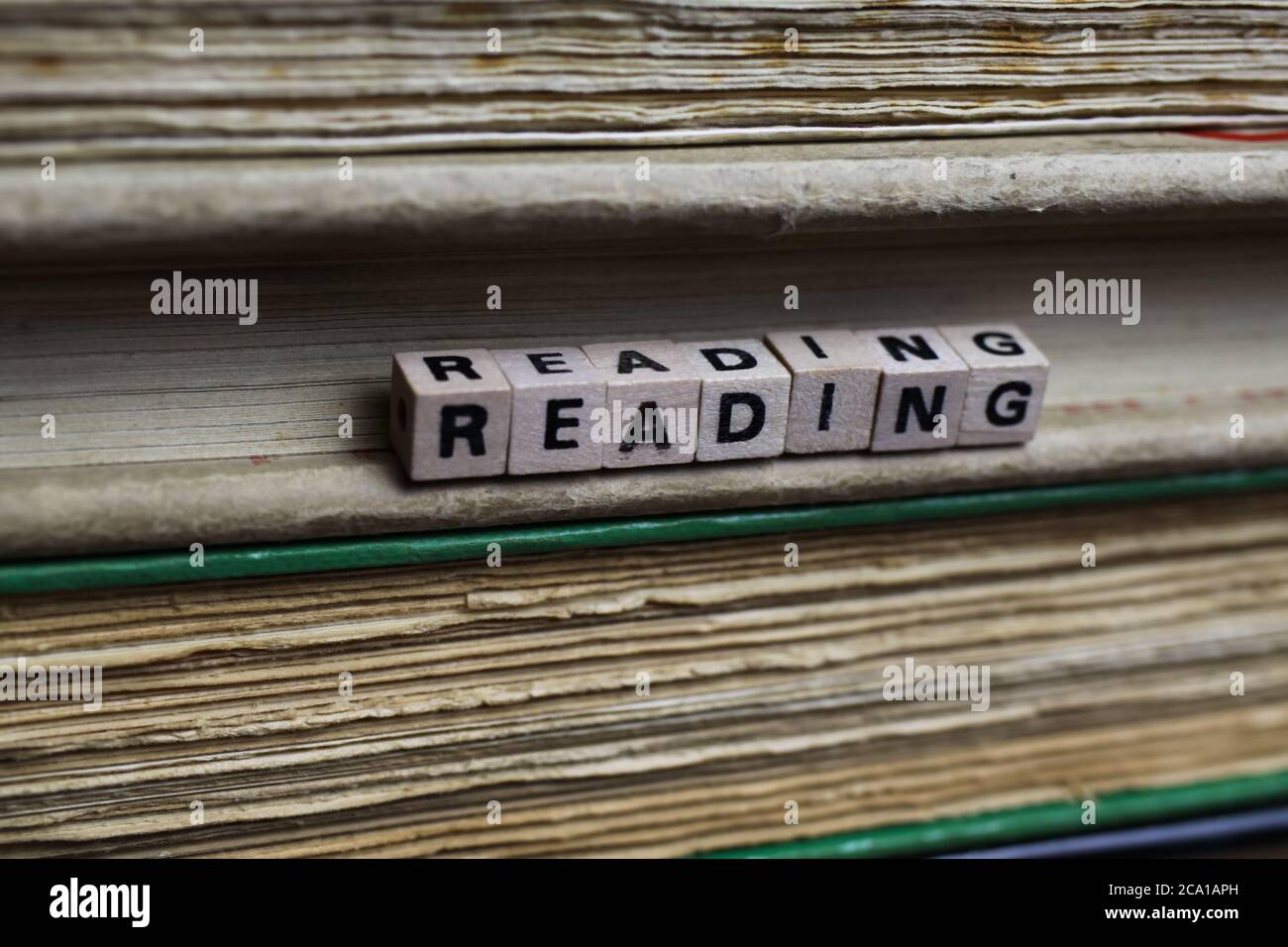 Closeup of isolated antique old book pile text blocks and yellowed ...