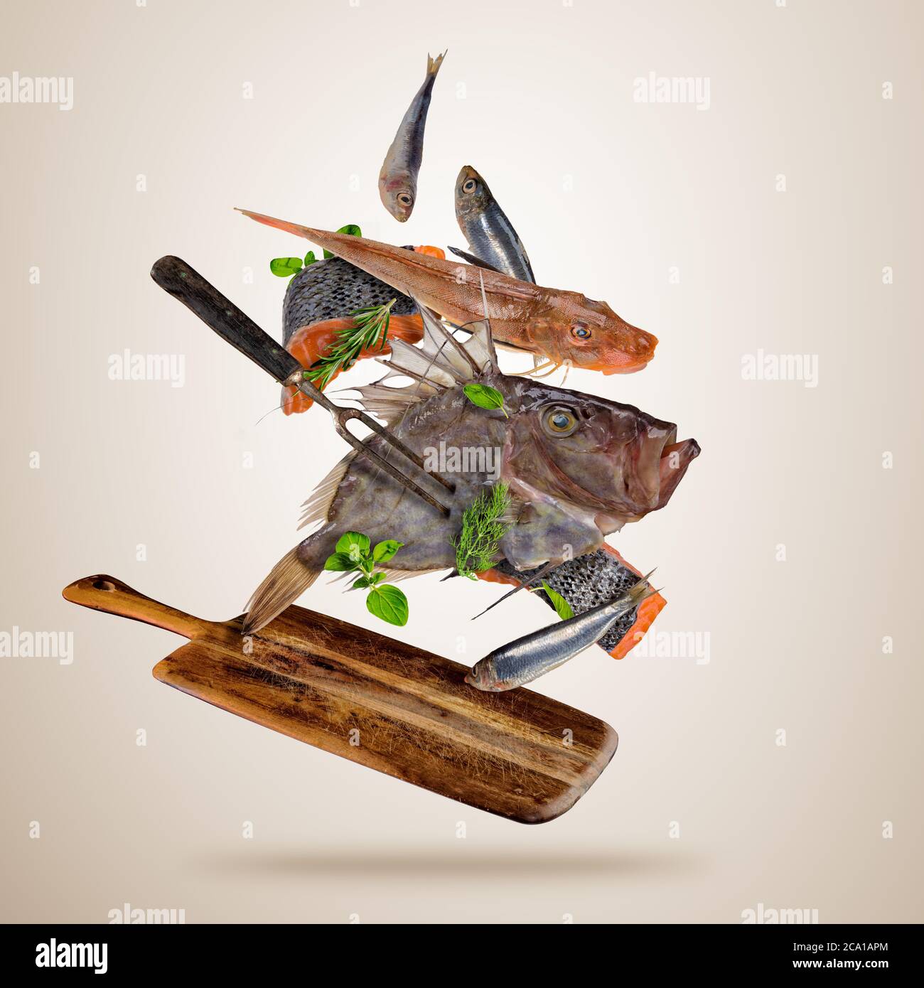 Fresh sea fish flying above wooden board, isolated on gray background ...