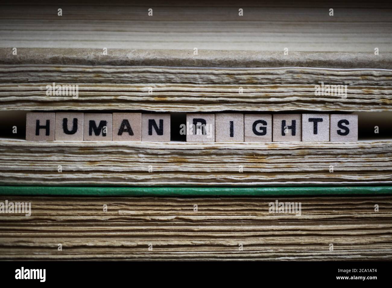 Human rights restriction concept: Closeup of isolated antique old book ...