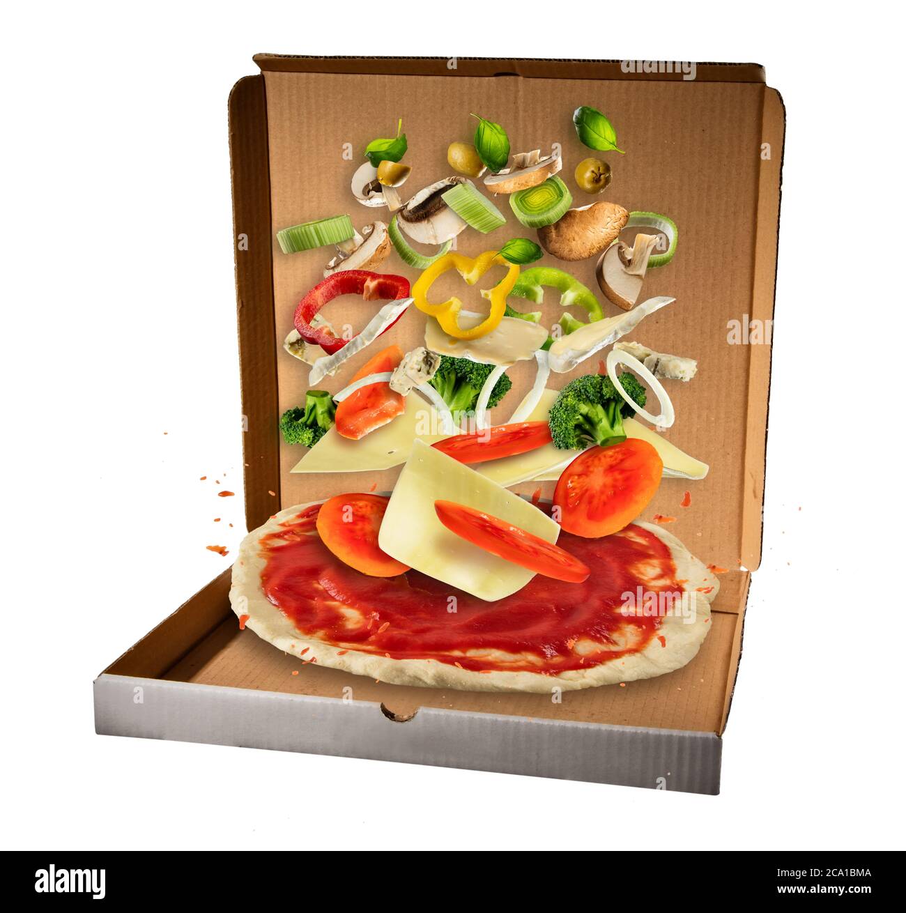 Flying ingredients with pizza dough in paper box, isolated on white ...