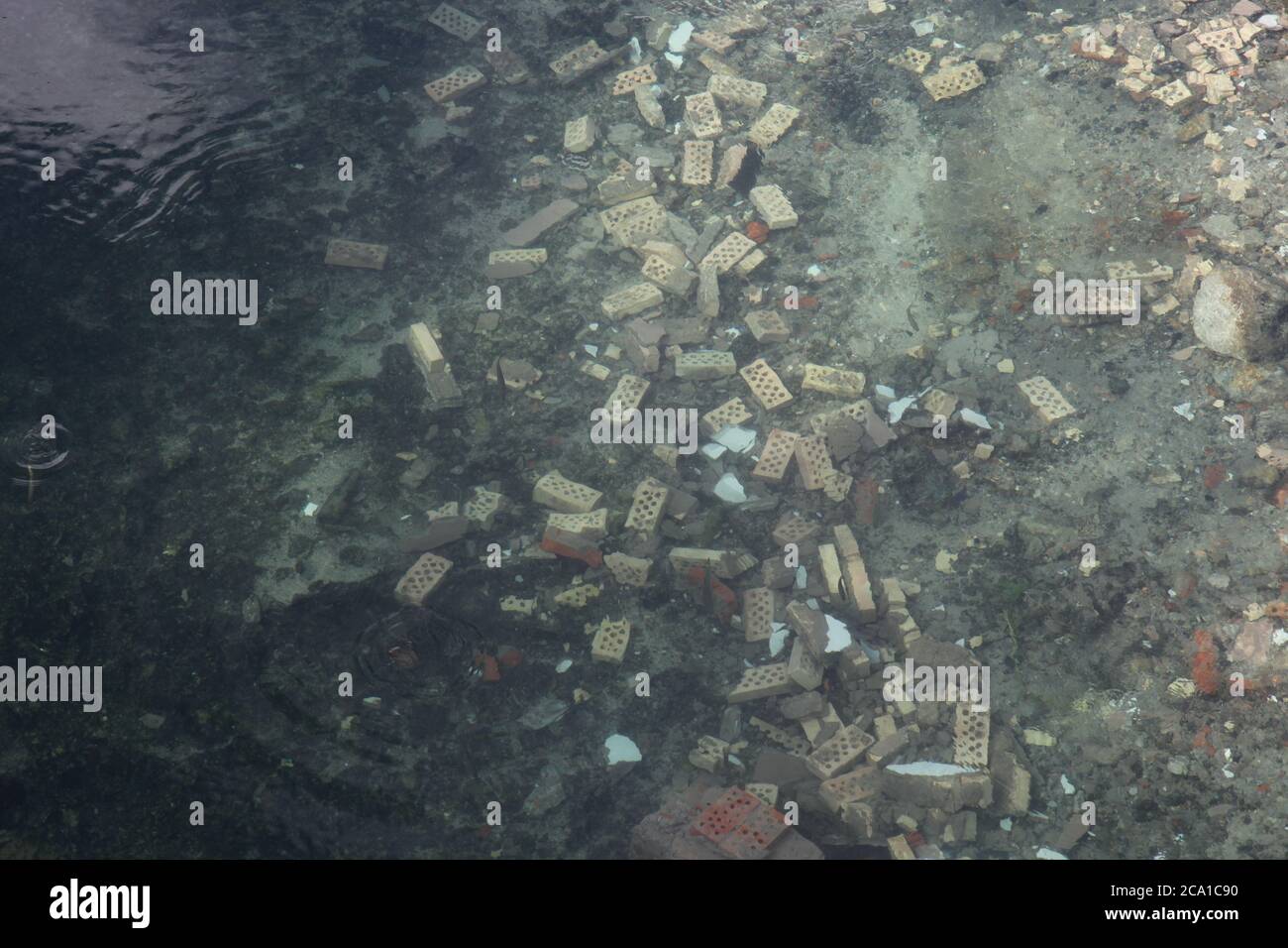 Stones found in river after house demolition Stock Photo - Alamy