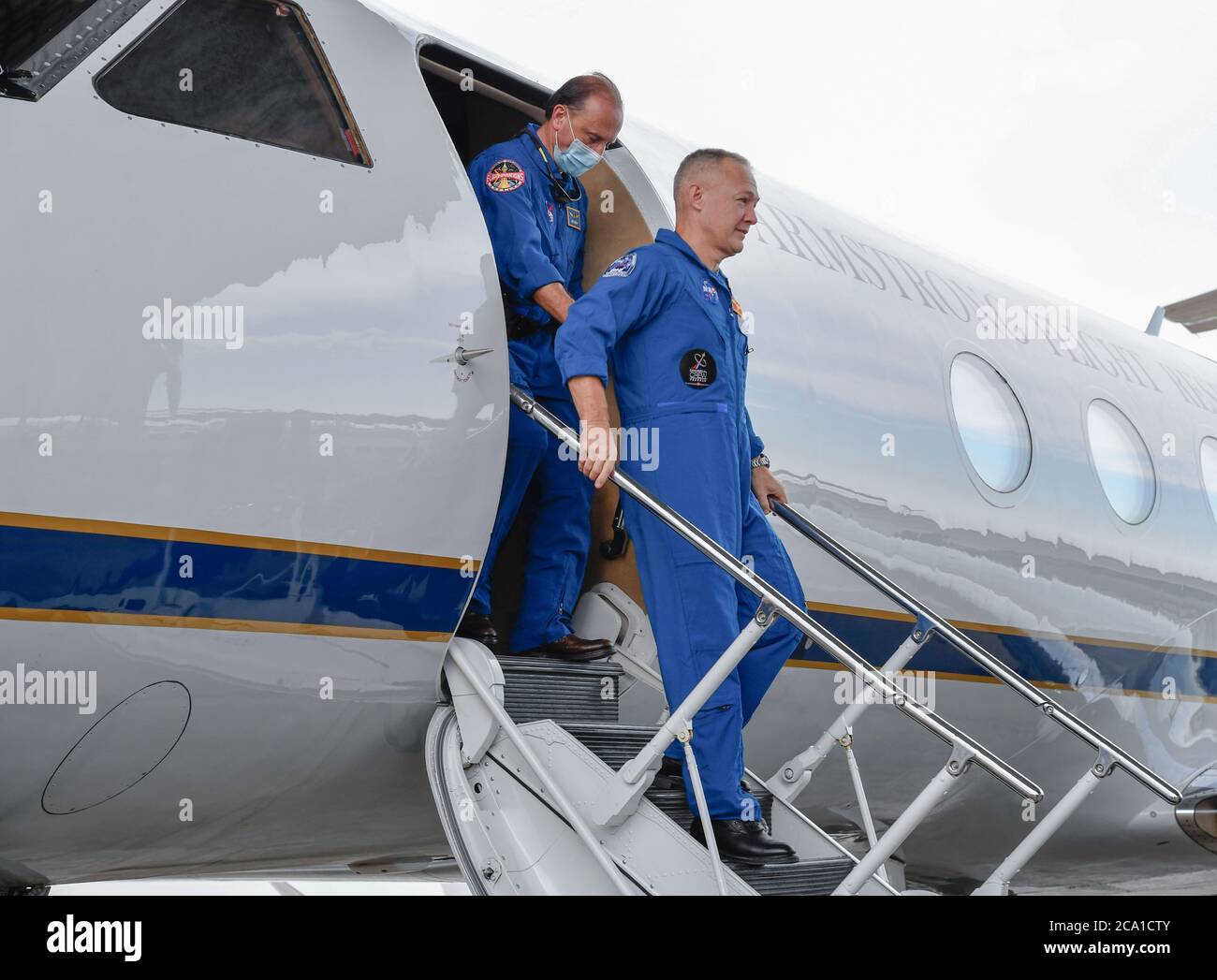 NASA astronaut Douglas Hurley, followed by flight surgeon Joe Dervay ...