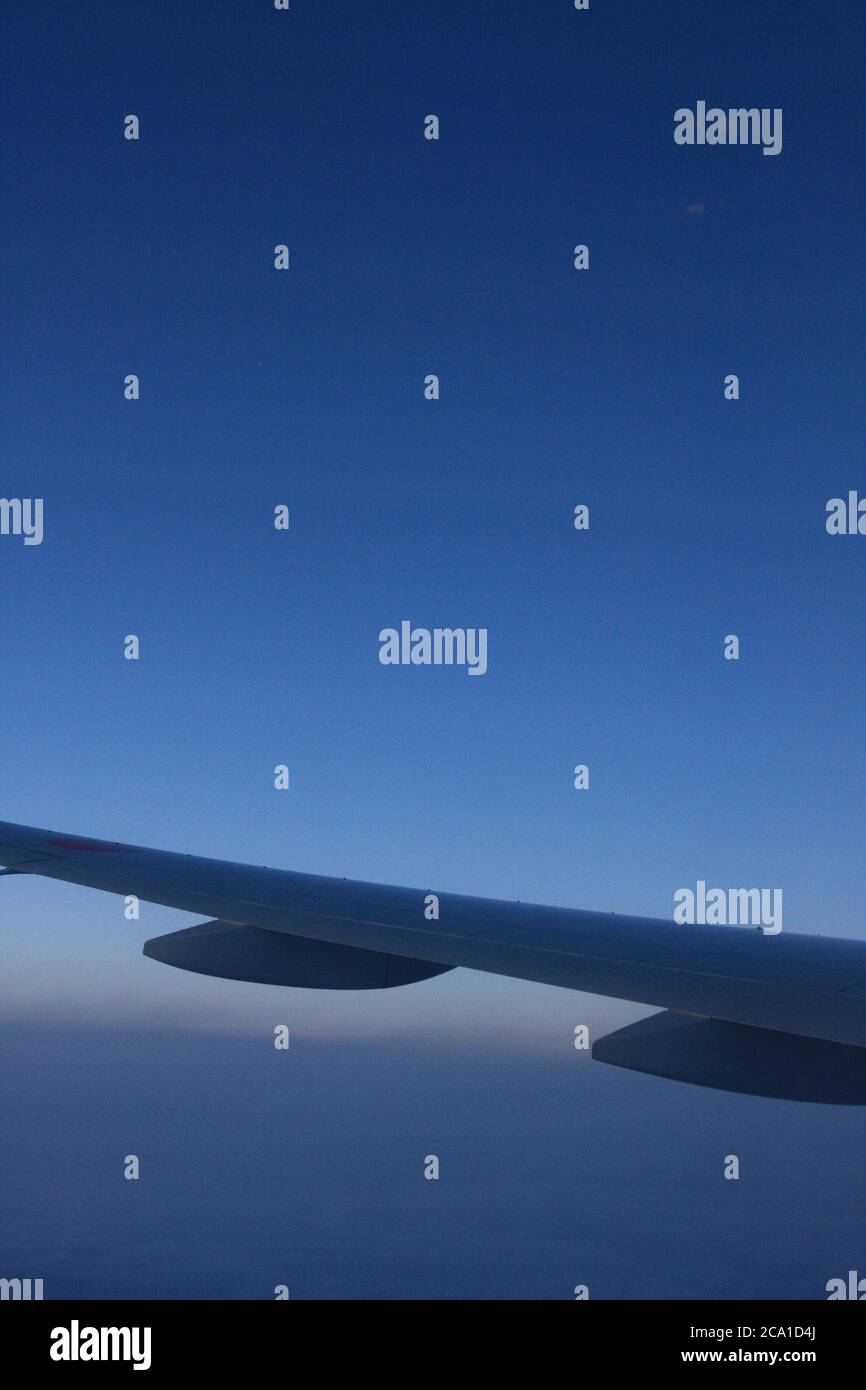 Airplane flying on deep blue hi-res stock photography and images - Alamy