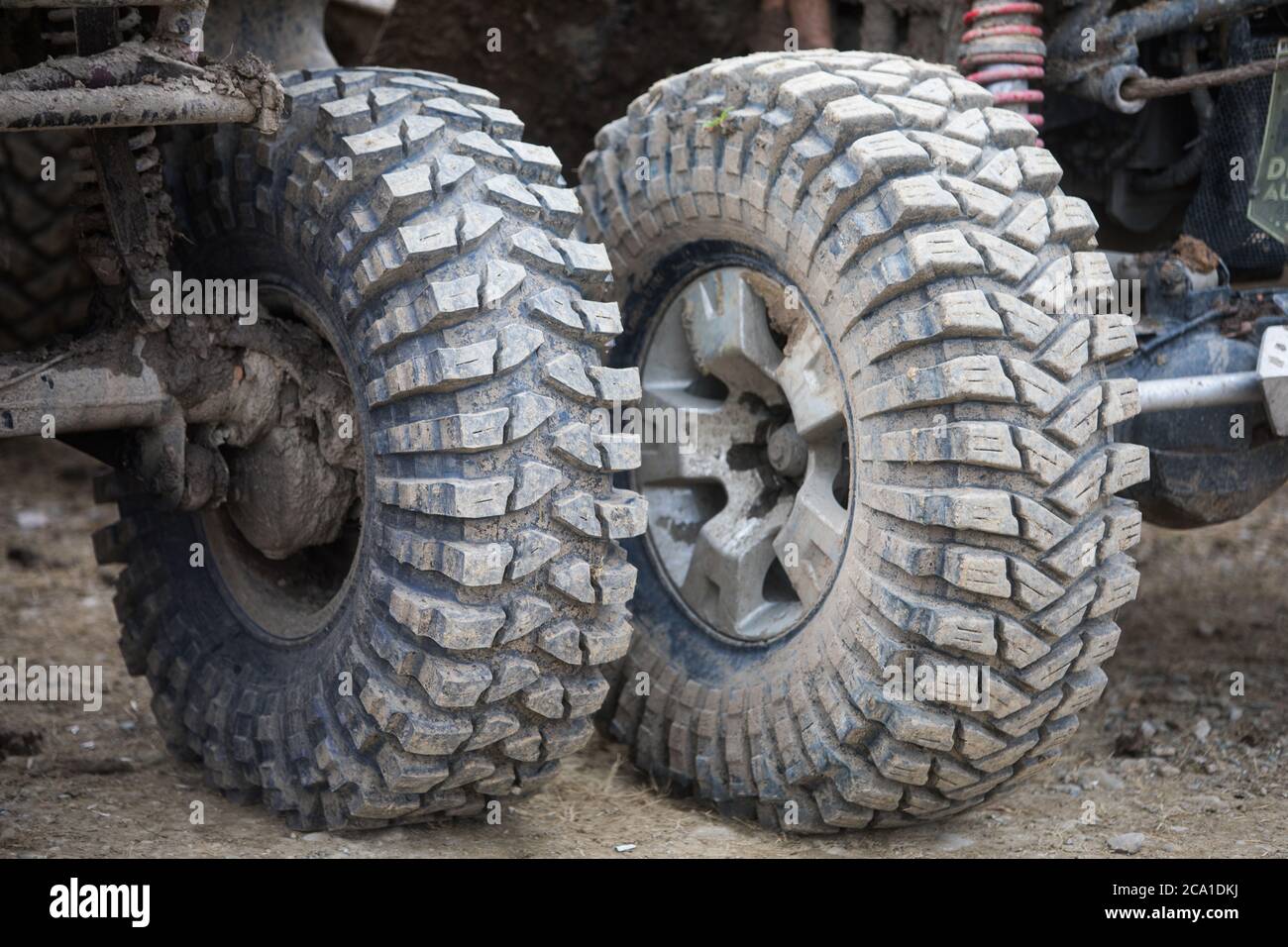 Close up shot of some muddy off road tires on 4x4 cars Stock Photo - Alamy